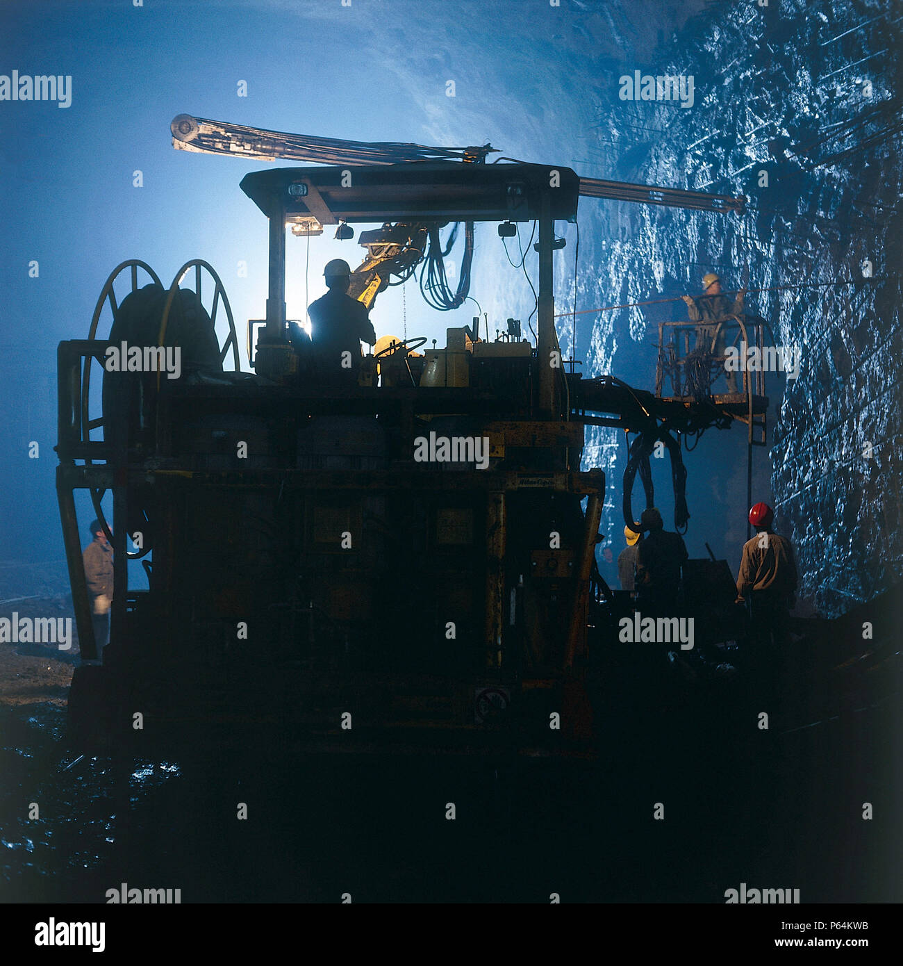 Atlas Copco Jumbo Drill Rig fixing rock anchors in pumphouse cavern ...