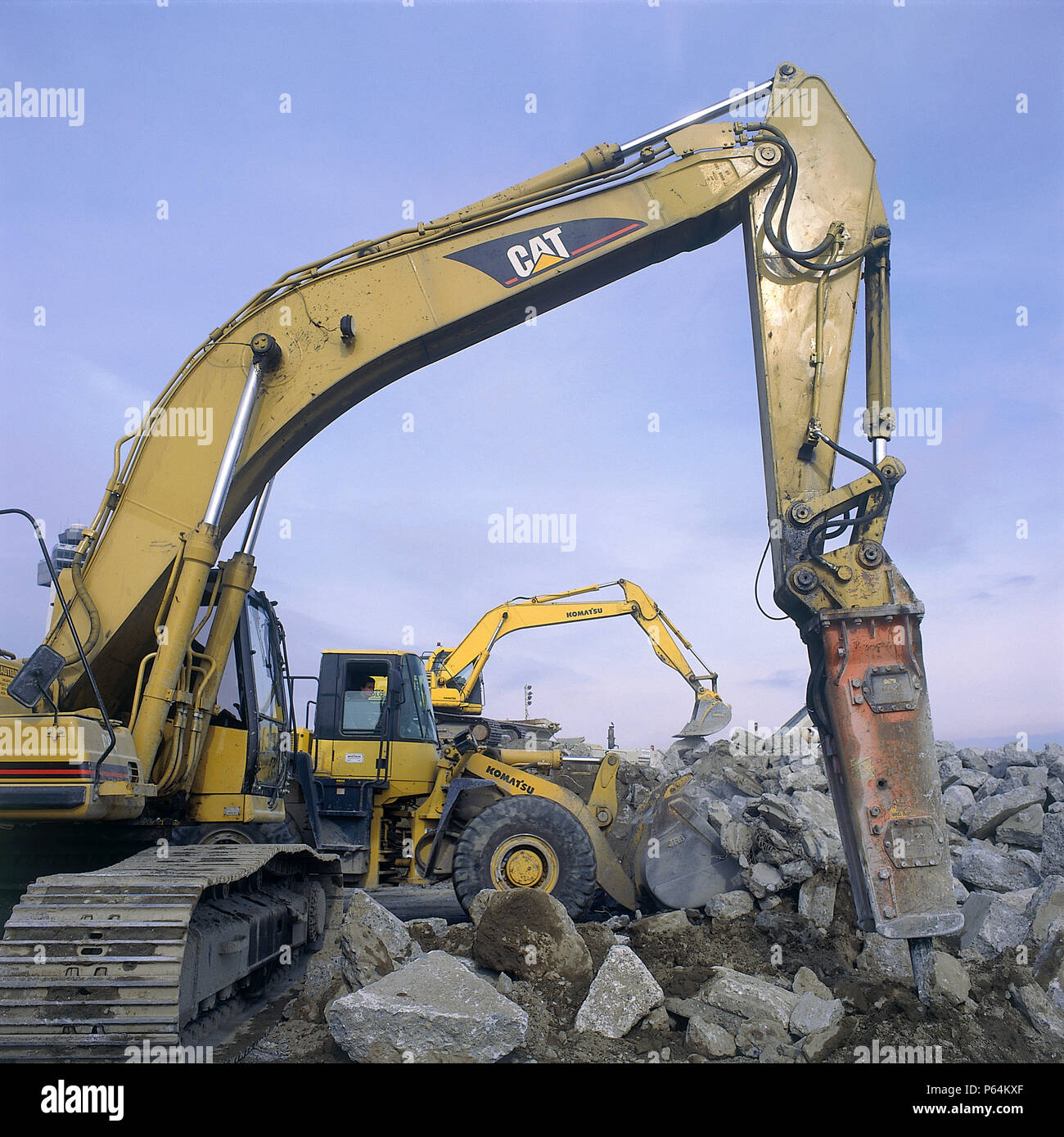 Hydraulic breaker attachment on Caterpillar excavator with Komatsu ...