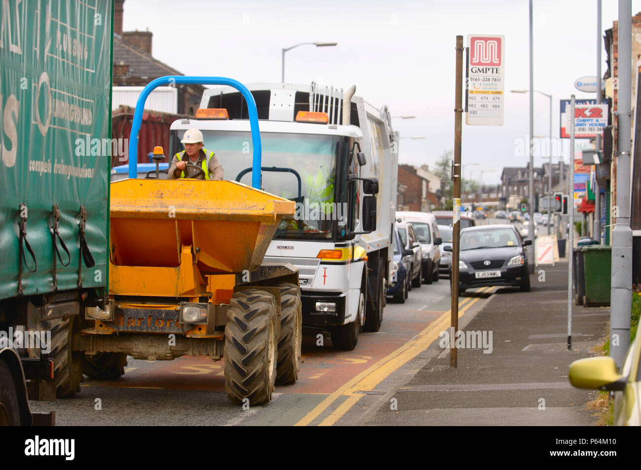 A dump truck in a queue of traffic in Bury, UK Stock Photo - Alamy
