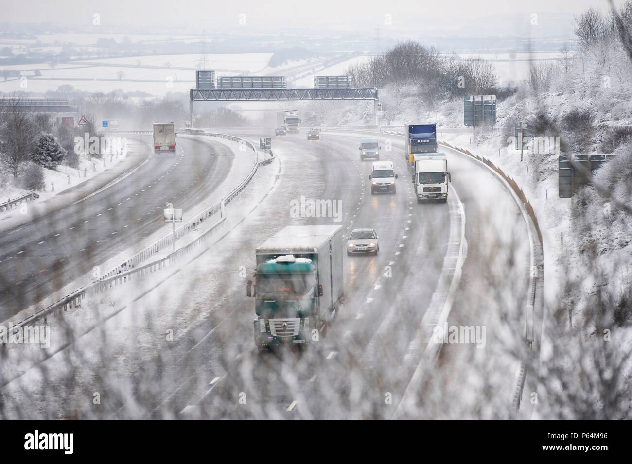 Traffic on motorway in snowy weather, UK Stock Photo - Alamy