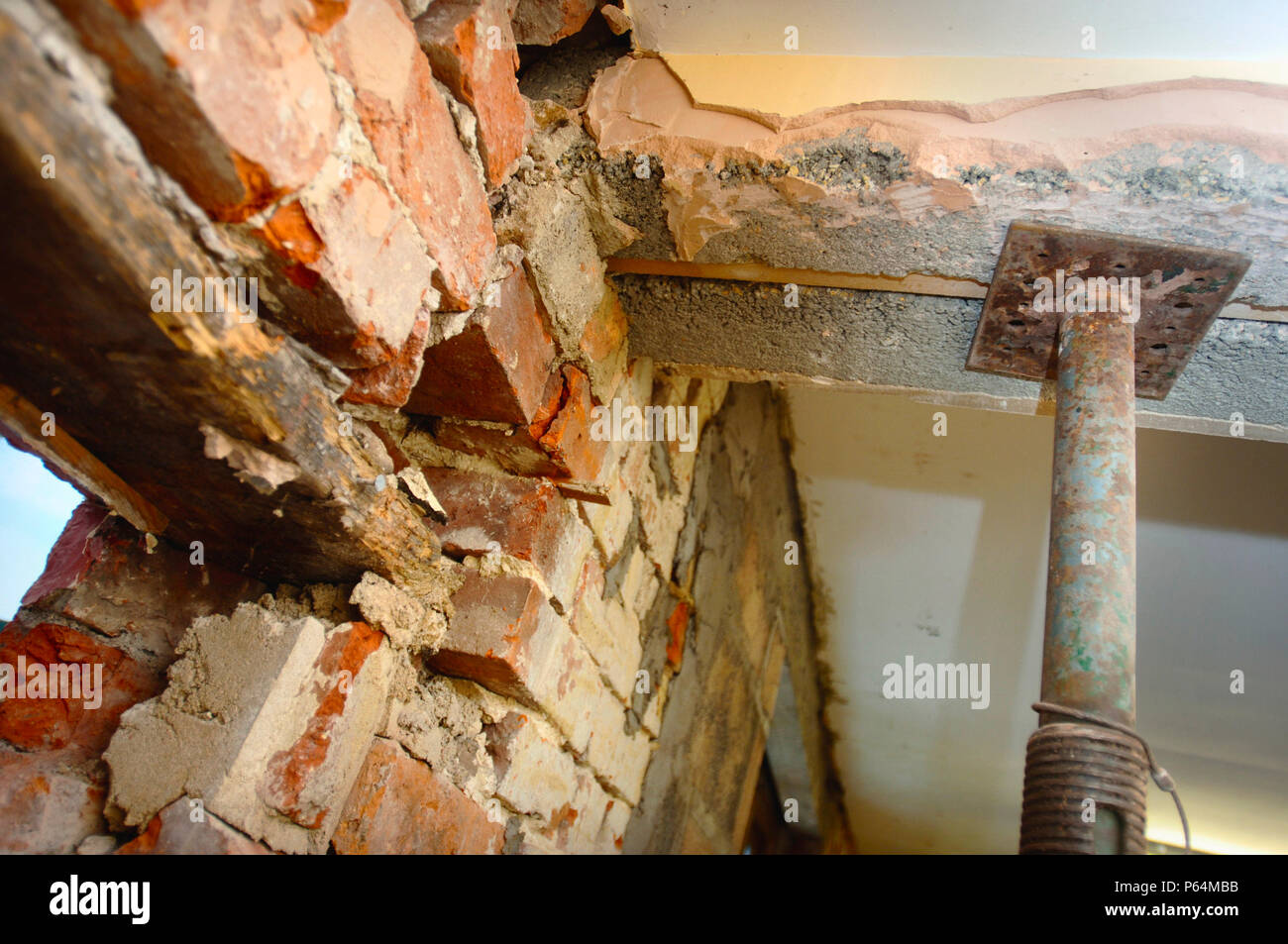 Acrow props holding a concrete lintel where a doorway with an old ...