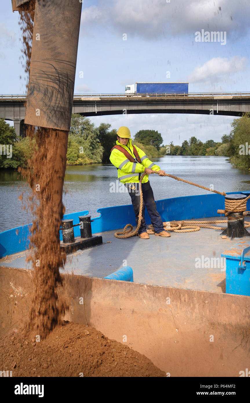 Loading aggregates onto a barge on The River Severn at Ripple Quarry ...
