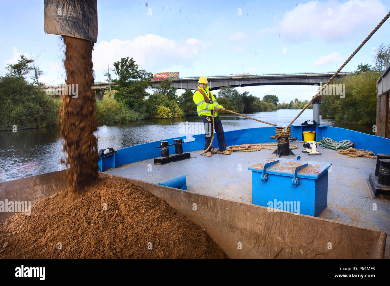 Loading aggregates onto a barge on The River Severn at Ripple Quarry ...