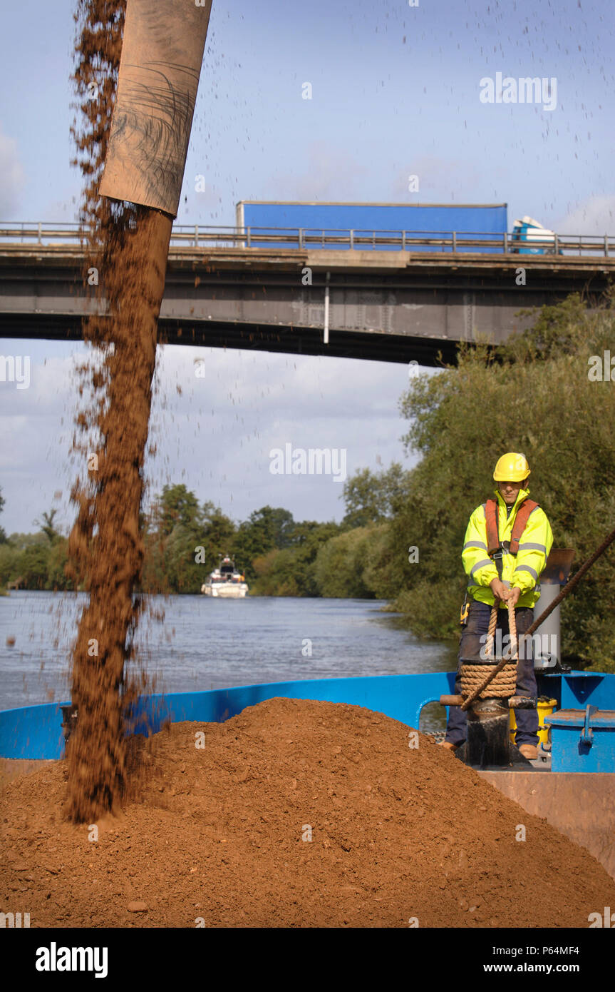 Loading aggregates onto a barge on The River Severn at Ripple Quarry ...
