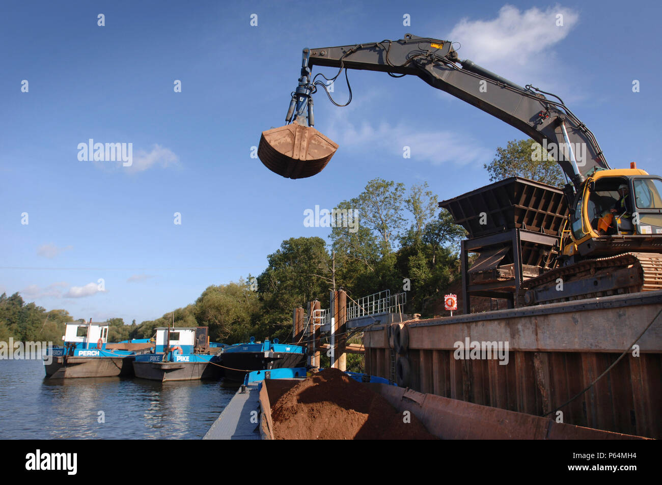 Unloading aggregates from a barge on The River Severn at Ryall Dock ...