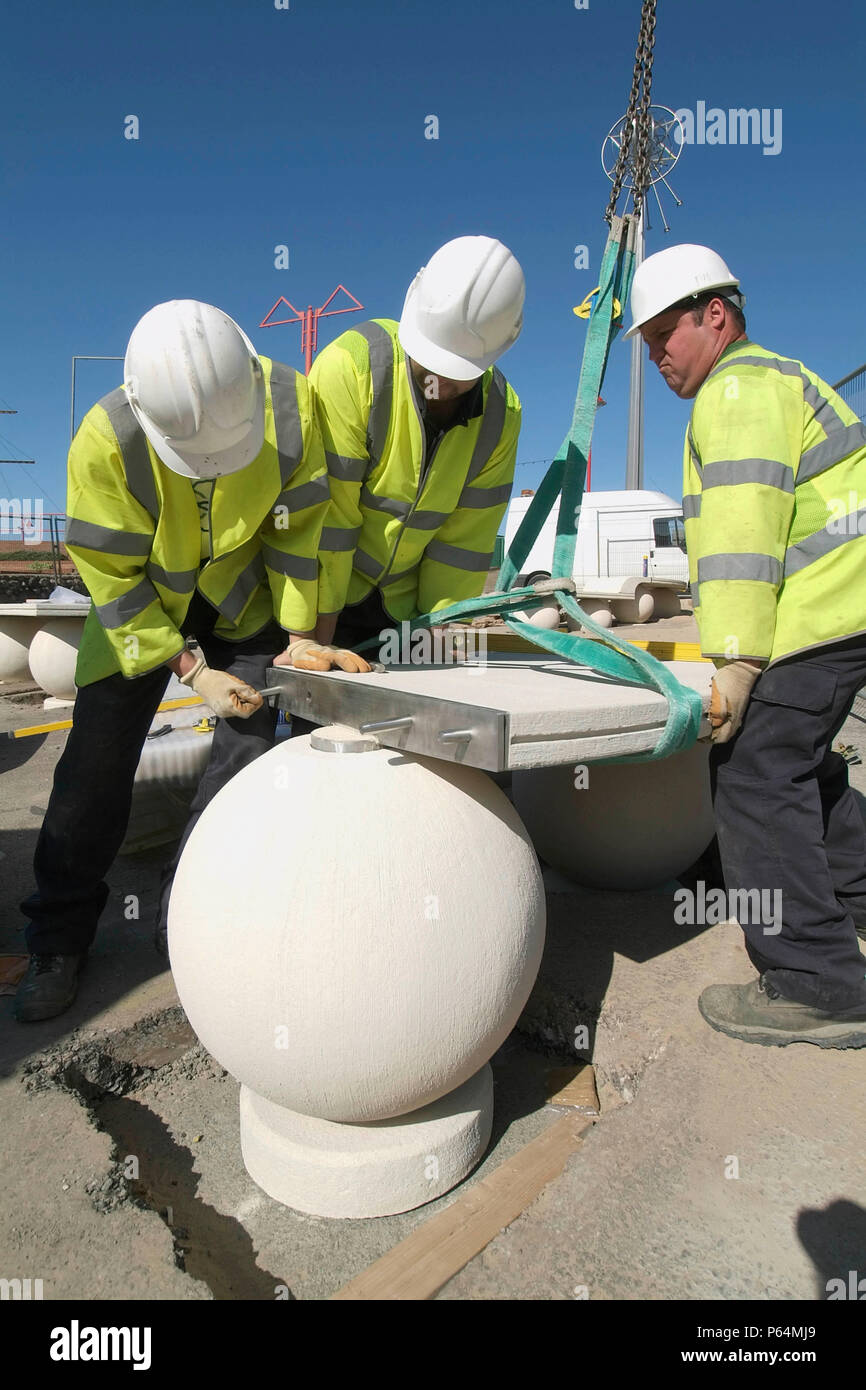Workmen assembling stone bench, Mablethorpe, Lincolnshire, UK Stock ...