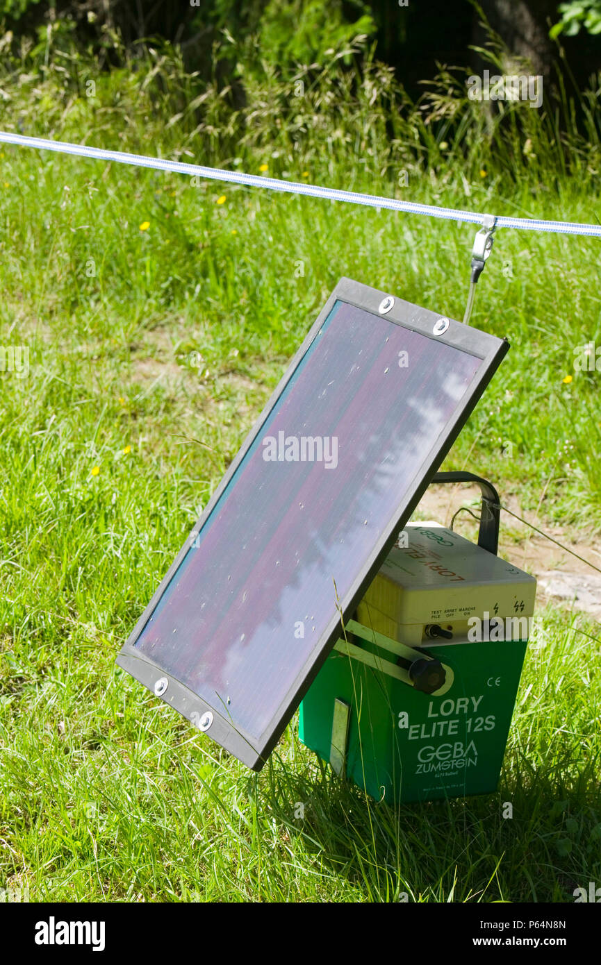 An electric fence powered by a solar panel Stock Photo - Alamy