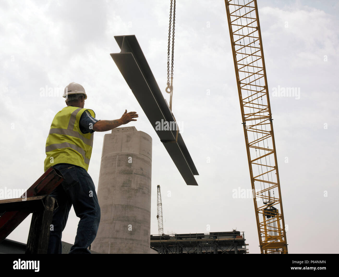 Steel Beam delivery on a construction site Stock Photo - Alamy