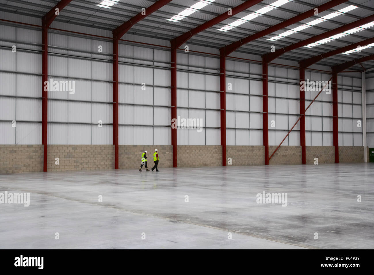 Warehouse showing new concrete slab Stock Photo - Alamy