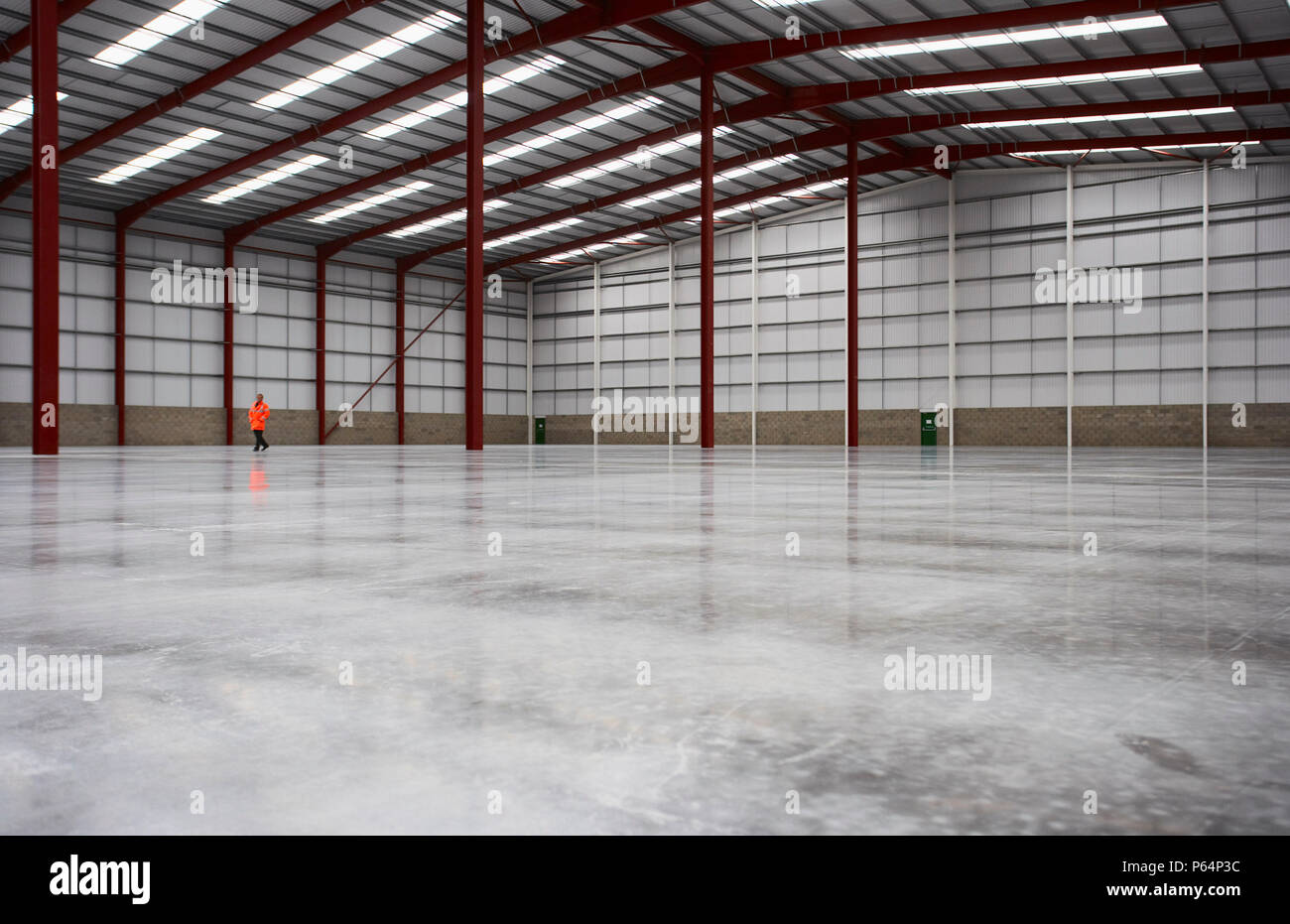 Warehouse showing new concrete slab Stock Photo - Alamy