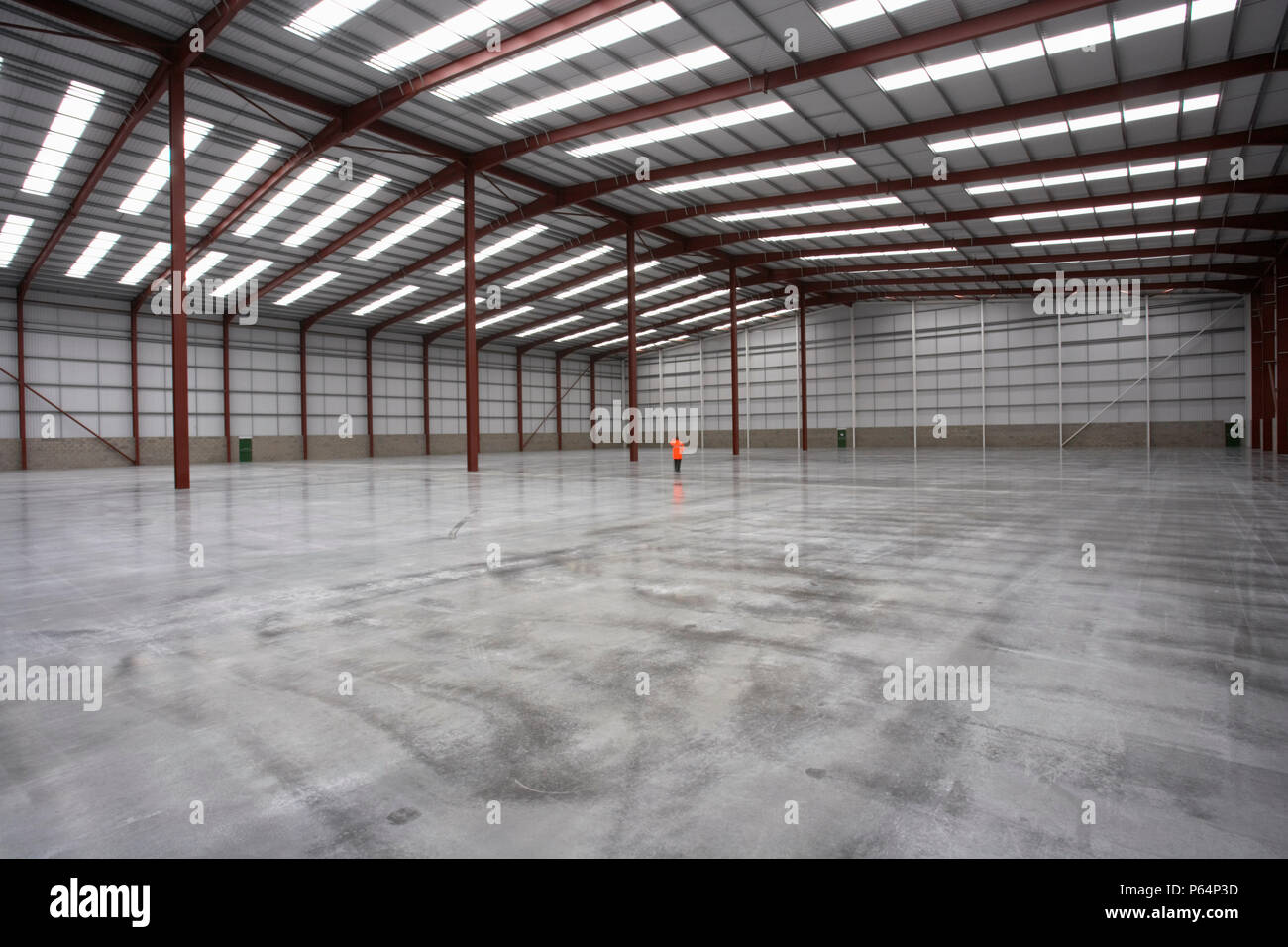 Warehouse showing new concrete slab Stock Photo - Alamy