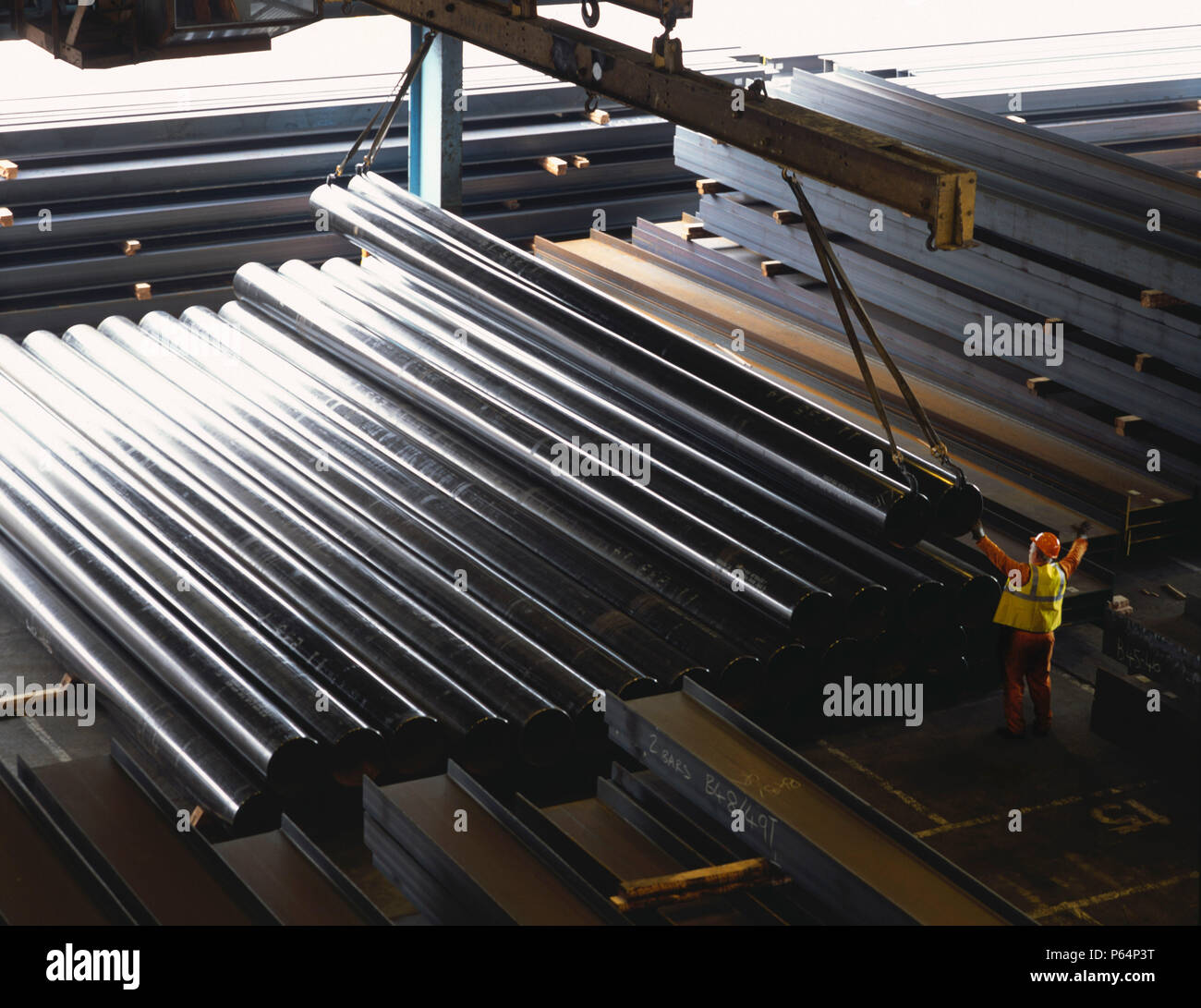 Unloading steel pipes. Teesside Docks. United Kingdom Stock Photo - Alamy