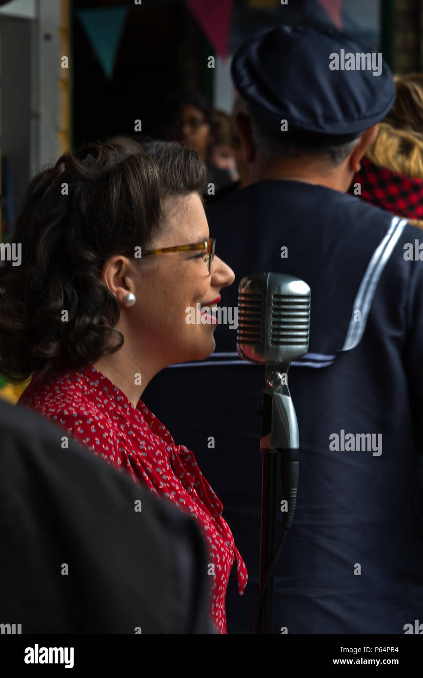 A singer entertaining passengers on the platform of Alton Station ...
