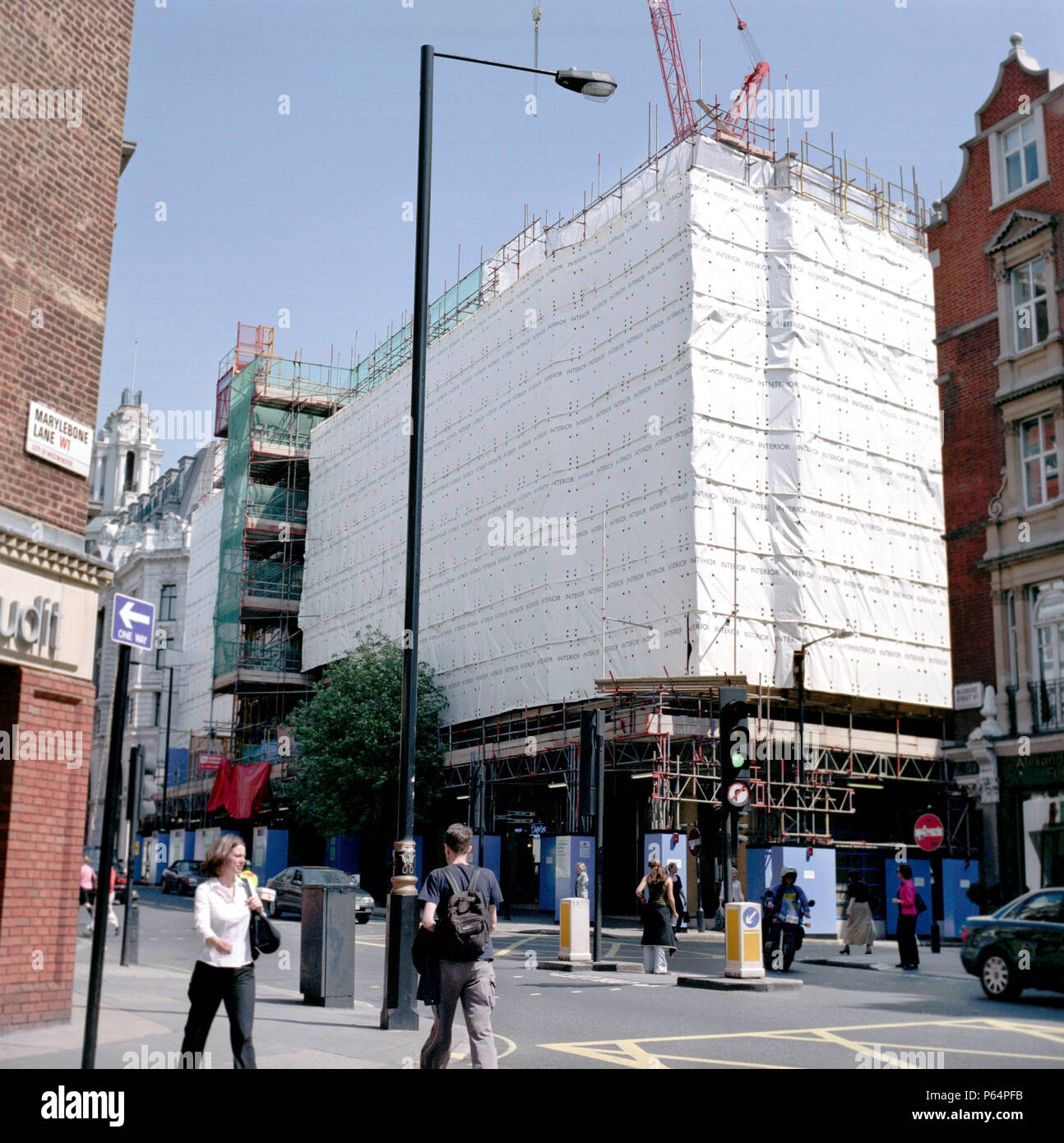 Building covered with a safety scaffolding Net Stock Photo - Alamy