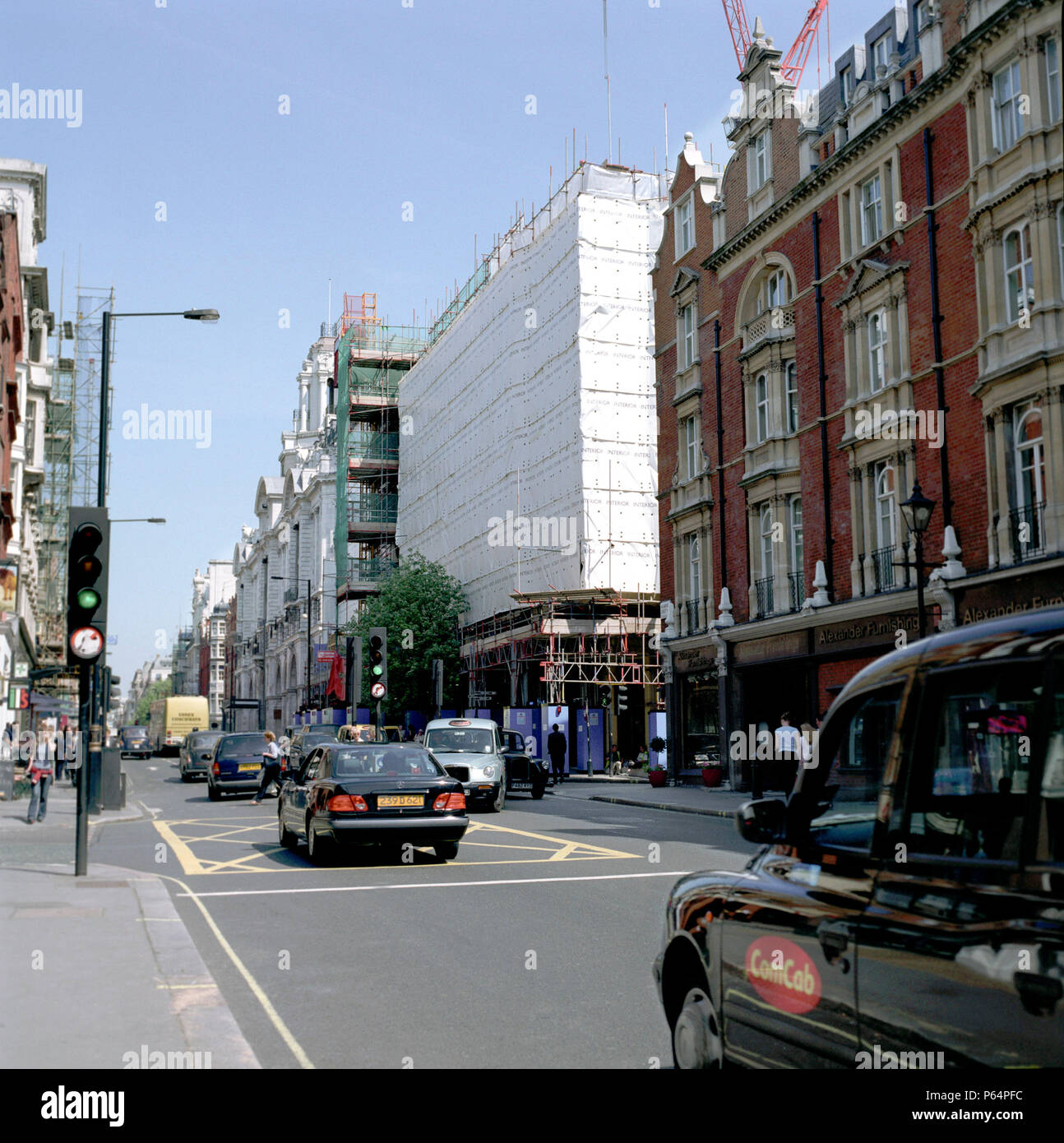 Building covered with a safety scaffolding Net Stock Photo - Alamy