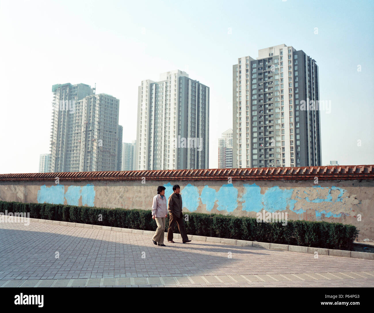 Pedestrians and new buildings in Beijing, China Stock Photo - Alamy
