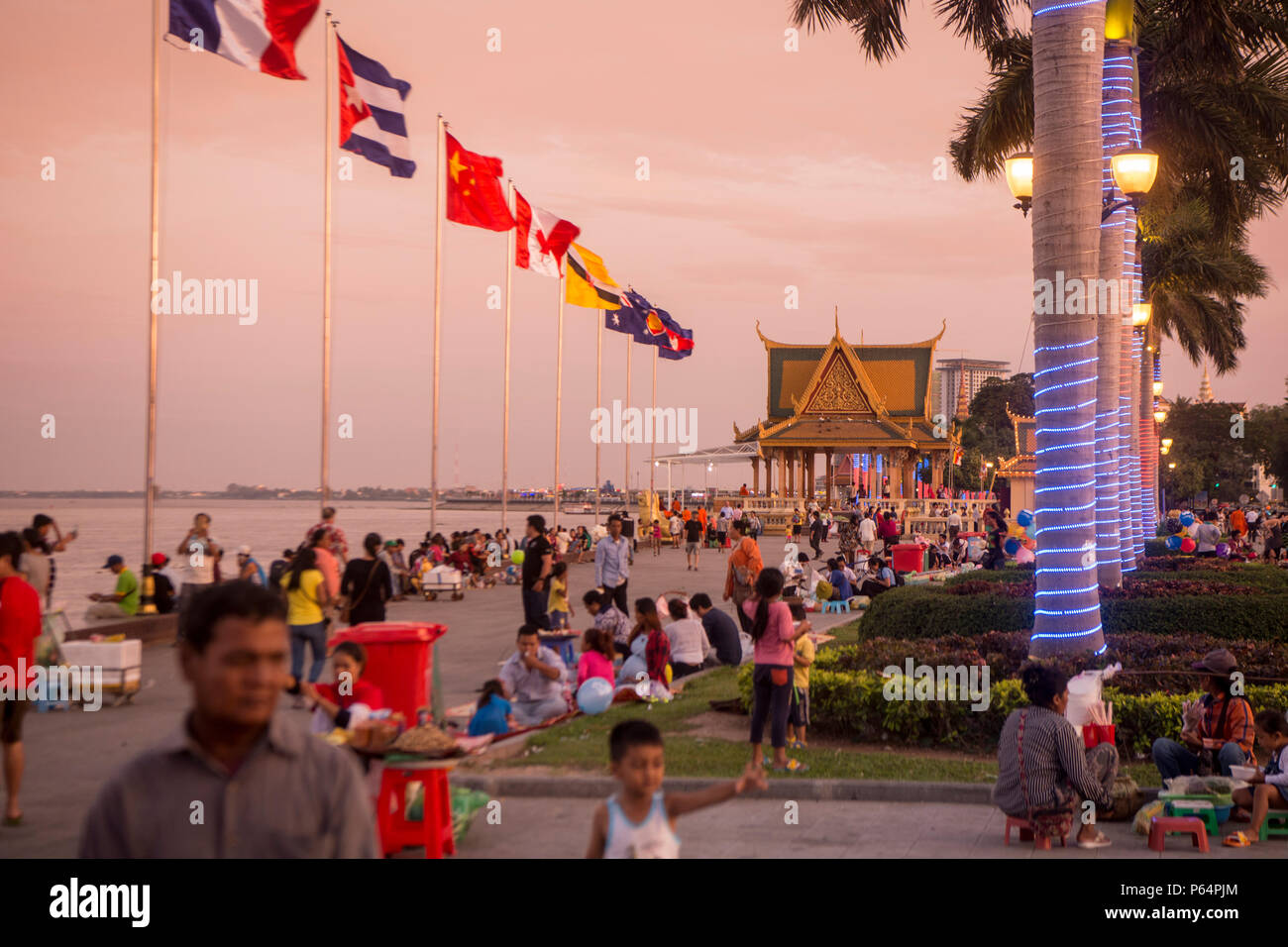 the Sisowath Quay at the Tonle Sap River in the city of Phnom Penh of ...