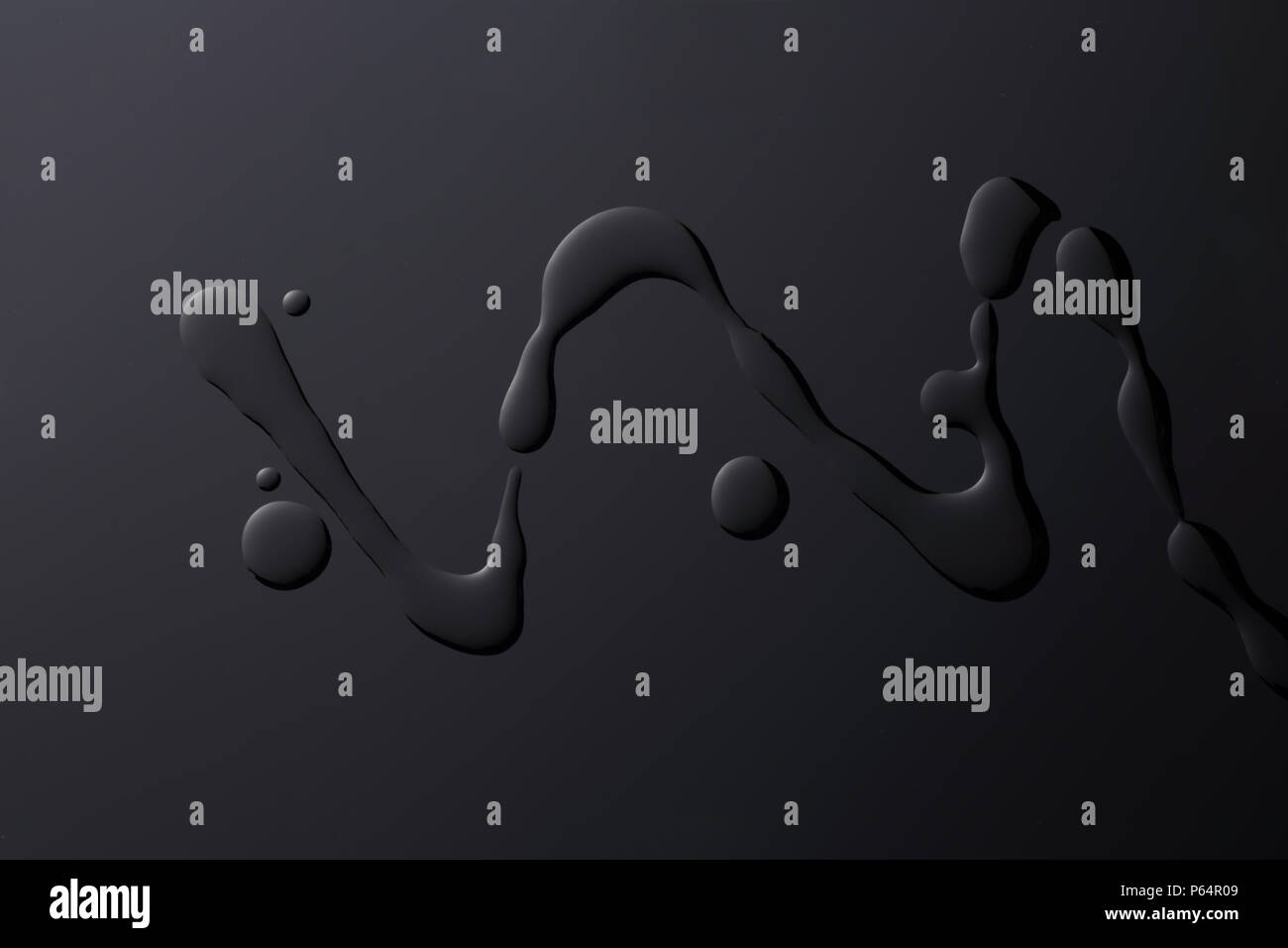 transparent liquid on black perspex Stock Photo - Alamy