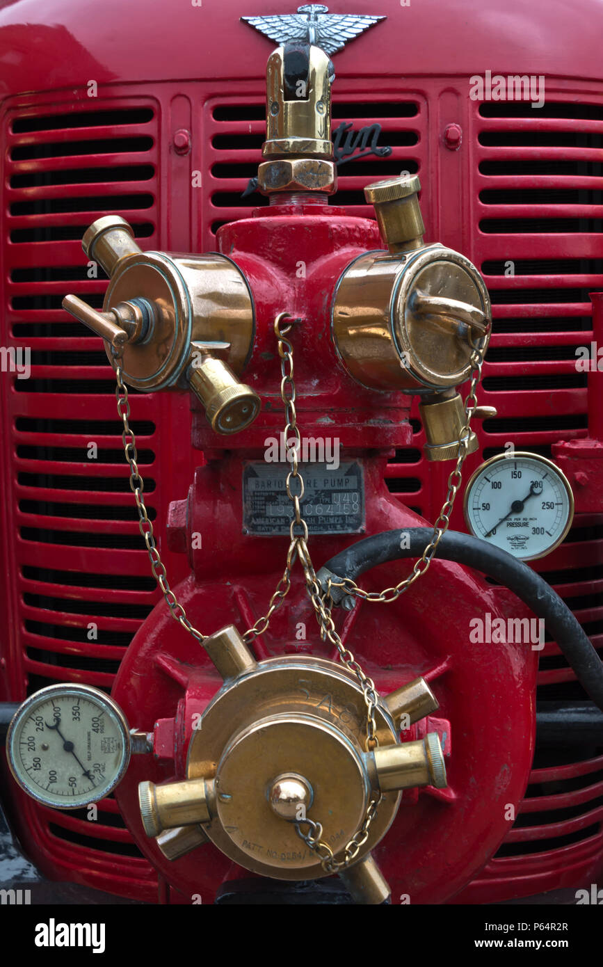 Water pump on the front end of a vintage fire engine on display at the ...