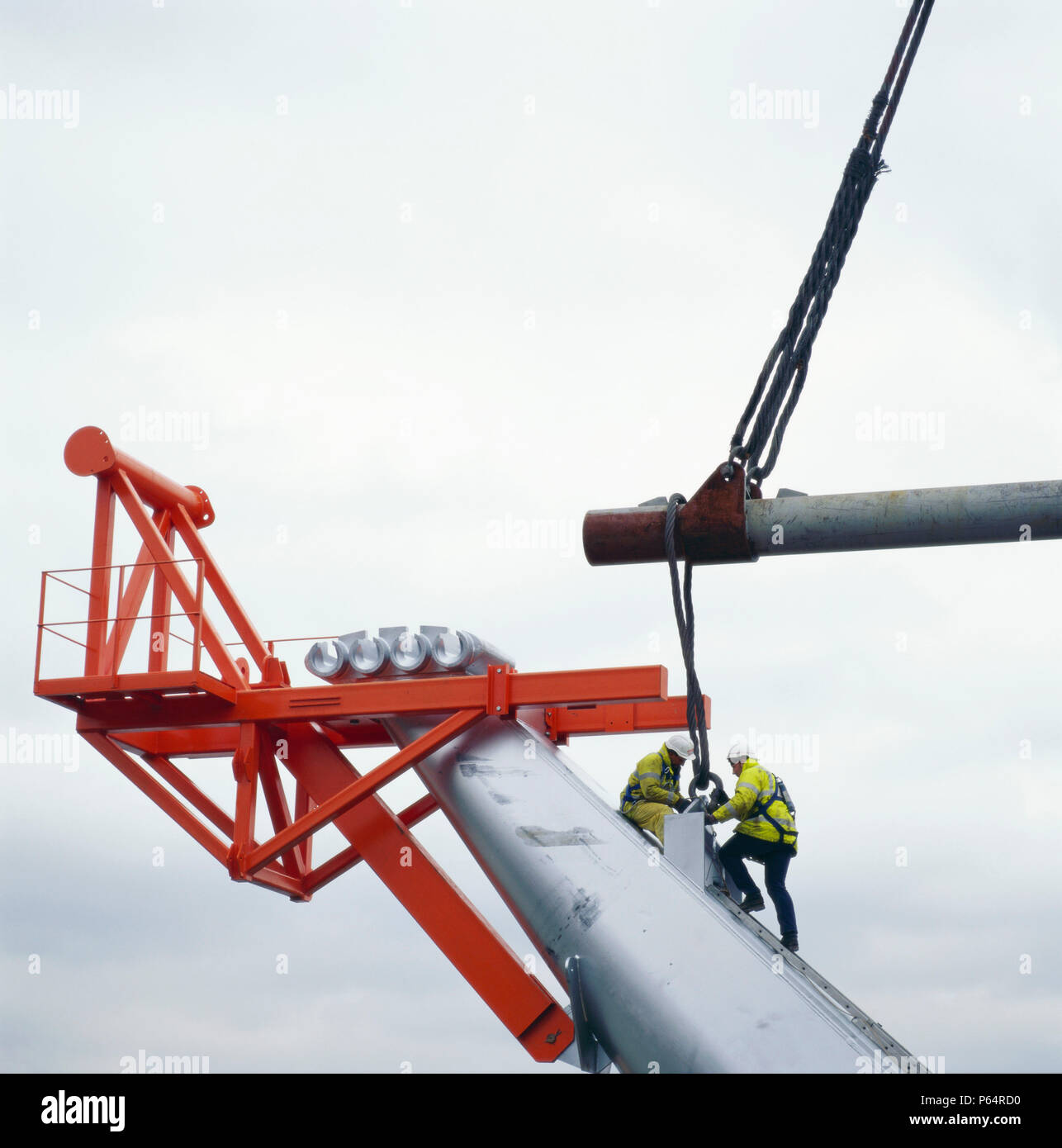 Placing pre-fabricated arms on pier base during the construction of the ...