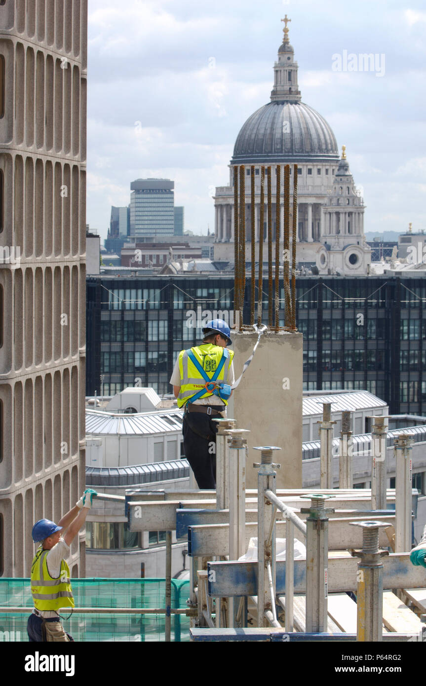 Construction workers wearing harnesses, New St Sq under construction ...