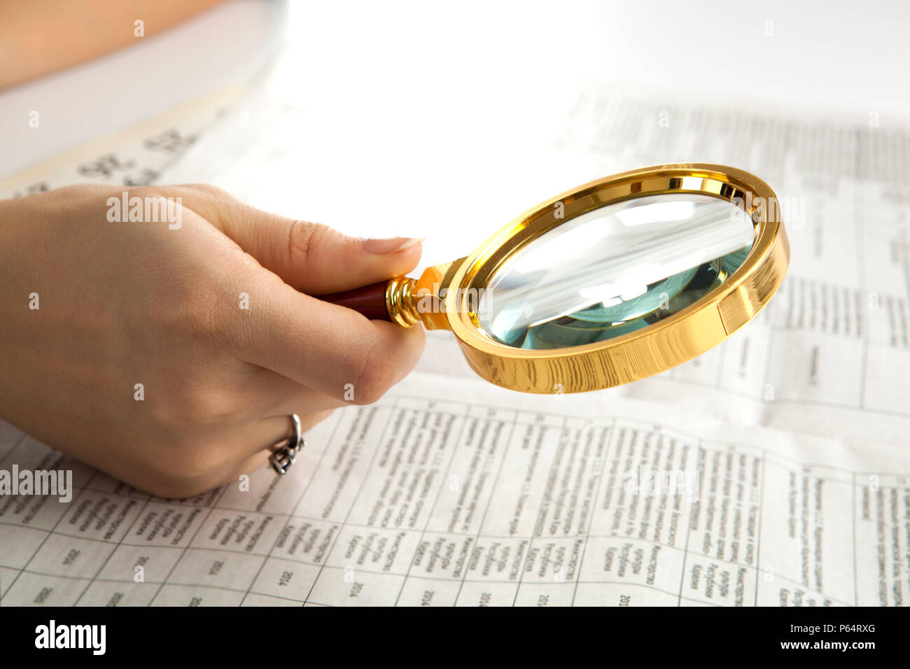 worker examines a magnifying glass text close up Stock Photo - Alamy