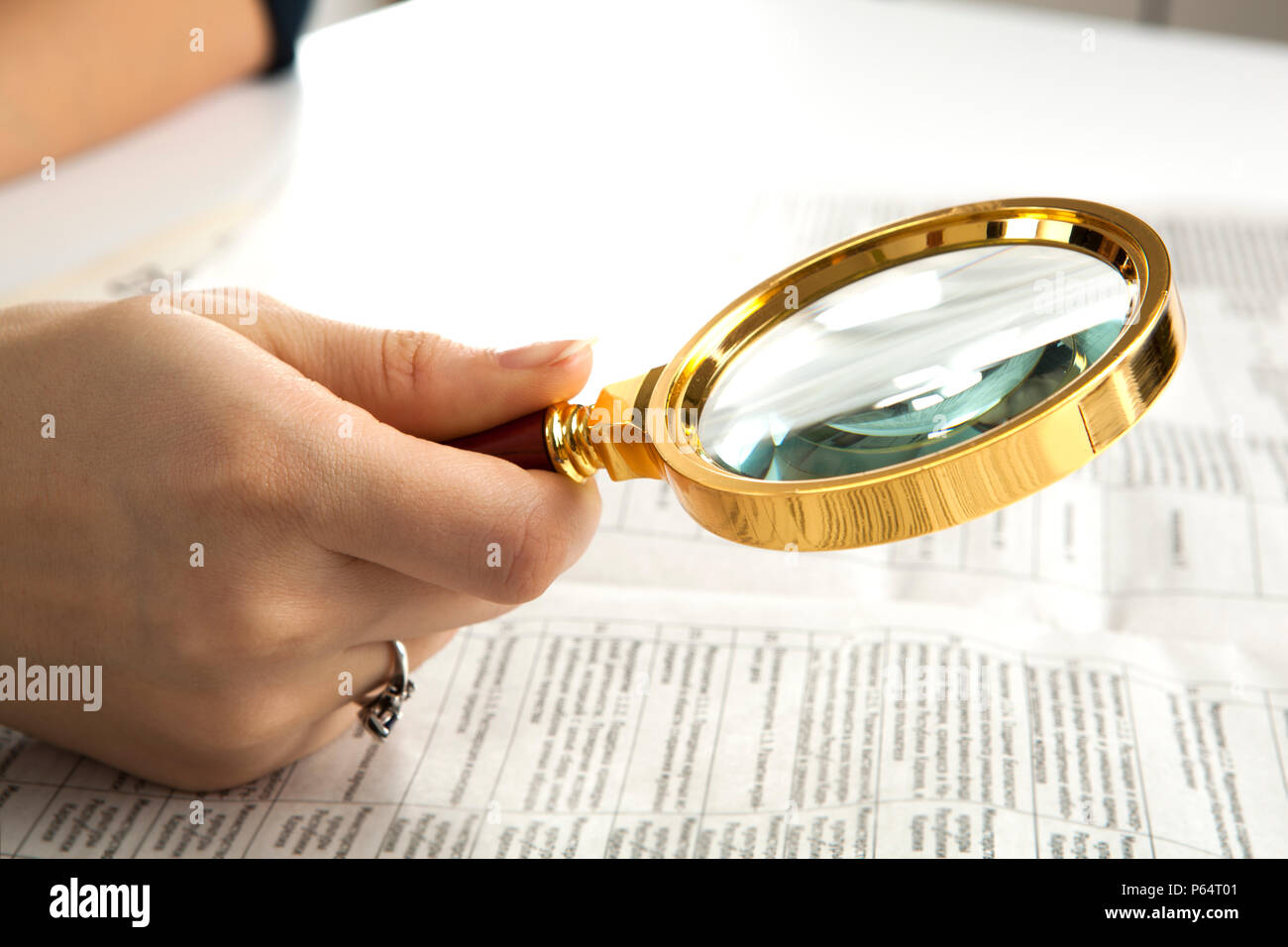 worker examines a magnifying glass text close up Stock Photo - Alamy