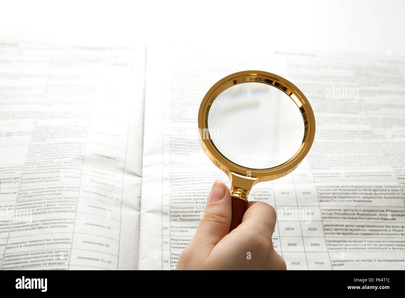 worker examines a magnifying glass text close up Stock Photo - Alamy