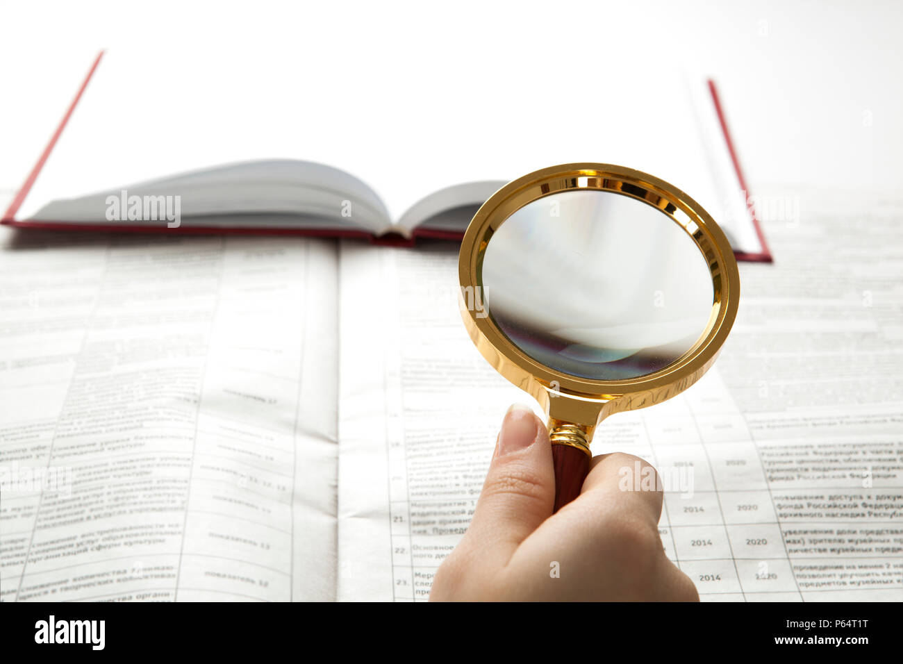 worker examines a magnifying glass text close up Stock Photo - Alamy