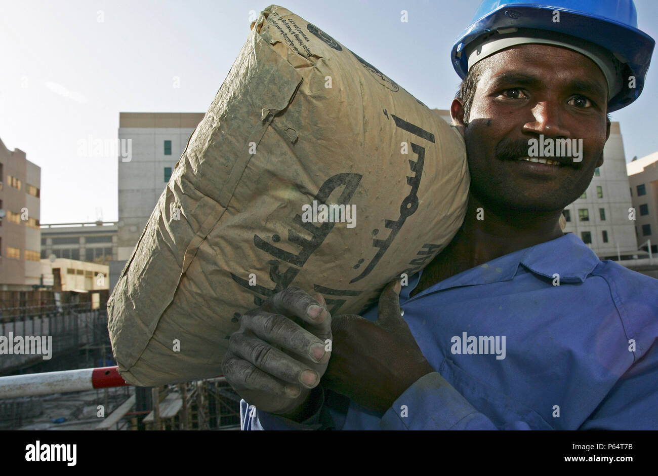 Man carrying cement bag hi-res stock photography and images - Alamy