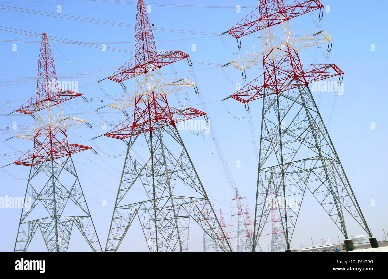 Electricity pylons, Abu Dhabi power station Stock Photo - Alamy