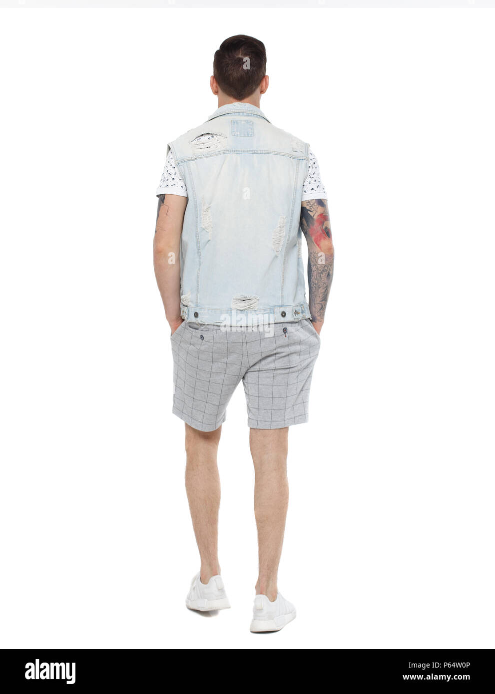 Back view of going handsome man in a shorts. walking young guy . Rear ...