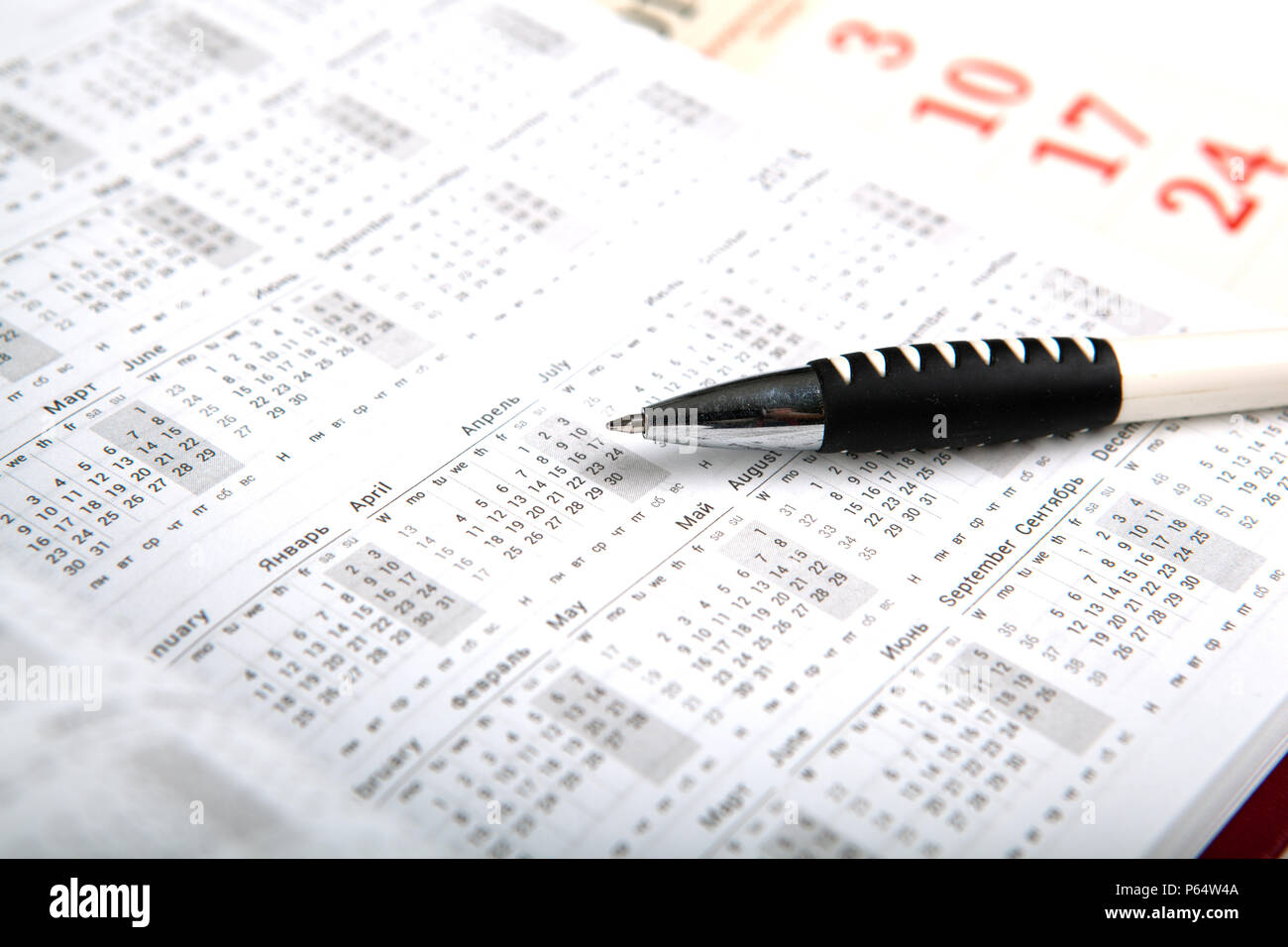 calendar days with numbers and pen close up Stock Photo - Alamy
