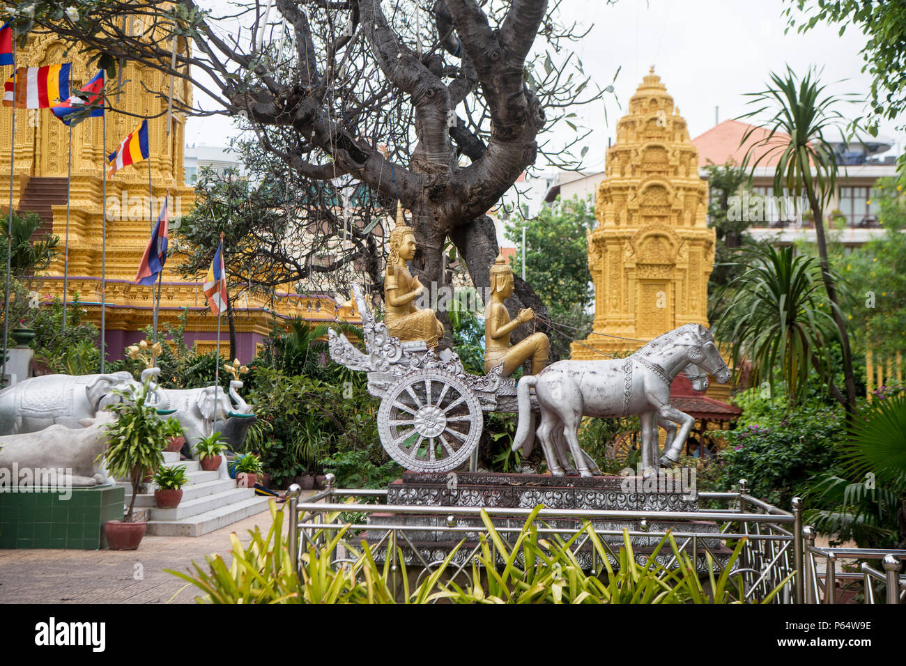 the garden of the Wat Ounalom at the Tonle Sap River in the city of ...