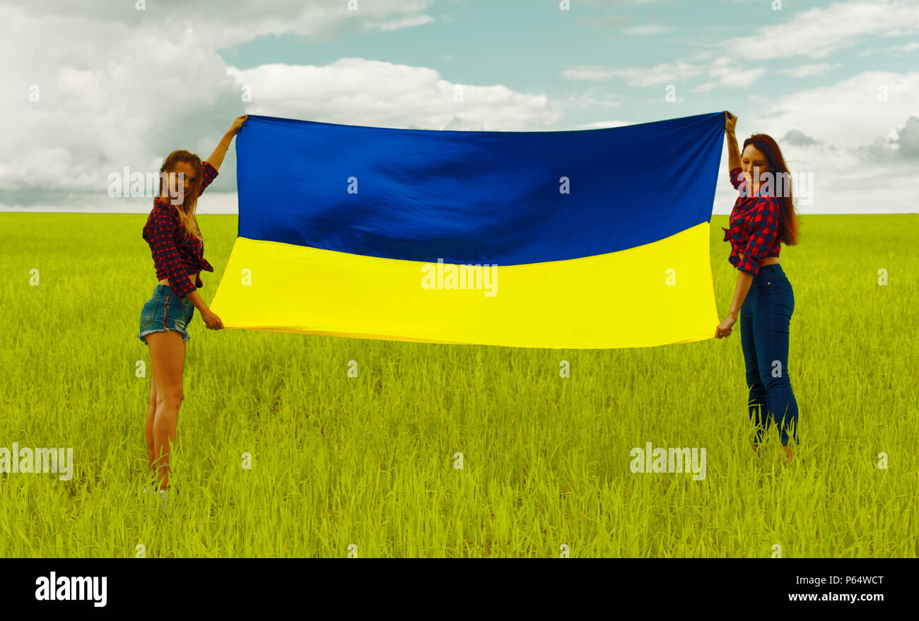 two young beautiful Ukrainian girl with an excellent figure unfurled ...
