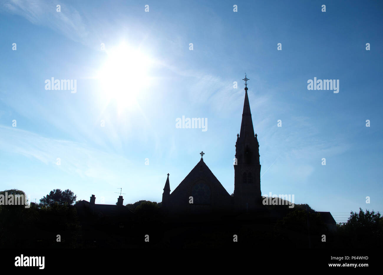 A silhouette of an old church and it's spire at Dundrum, on a sunny day ...