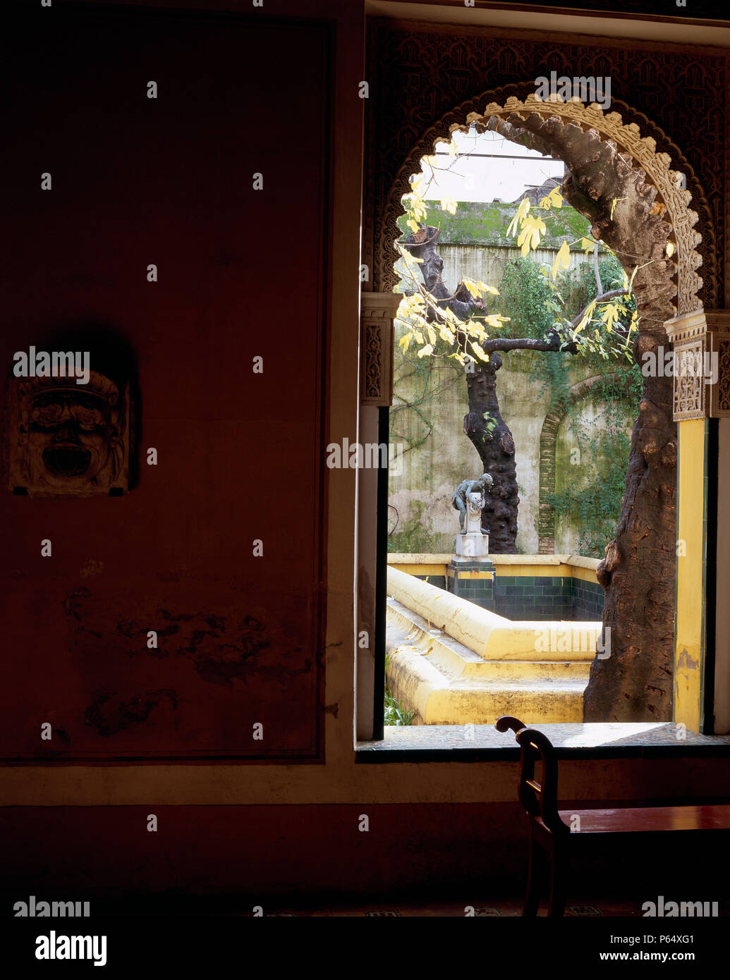 Traditional window with statue in background,casa de pilatos,Seville ...