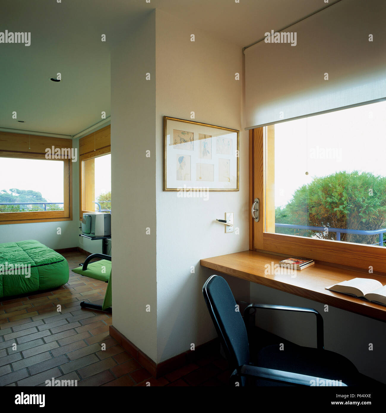 Partial view of a bedroom from a home office Stock Photo - Alamy