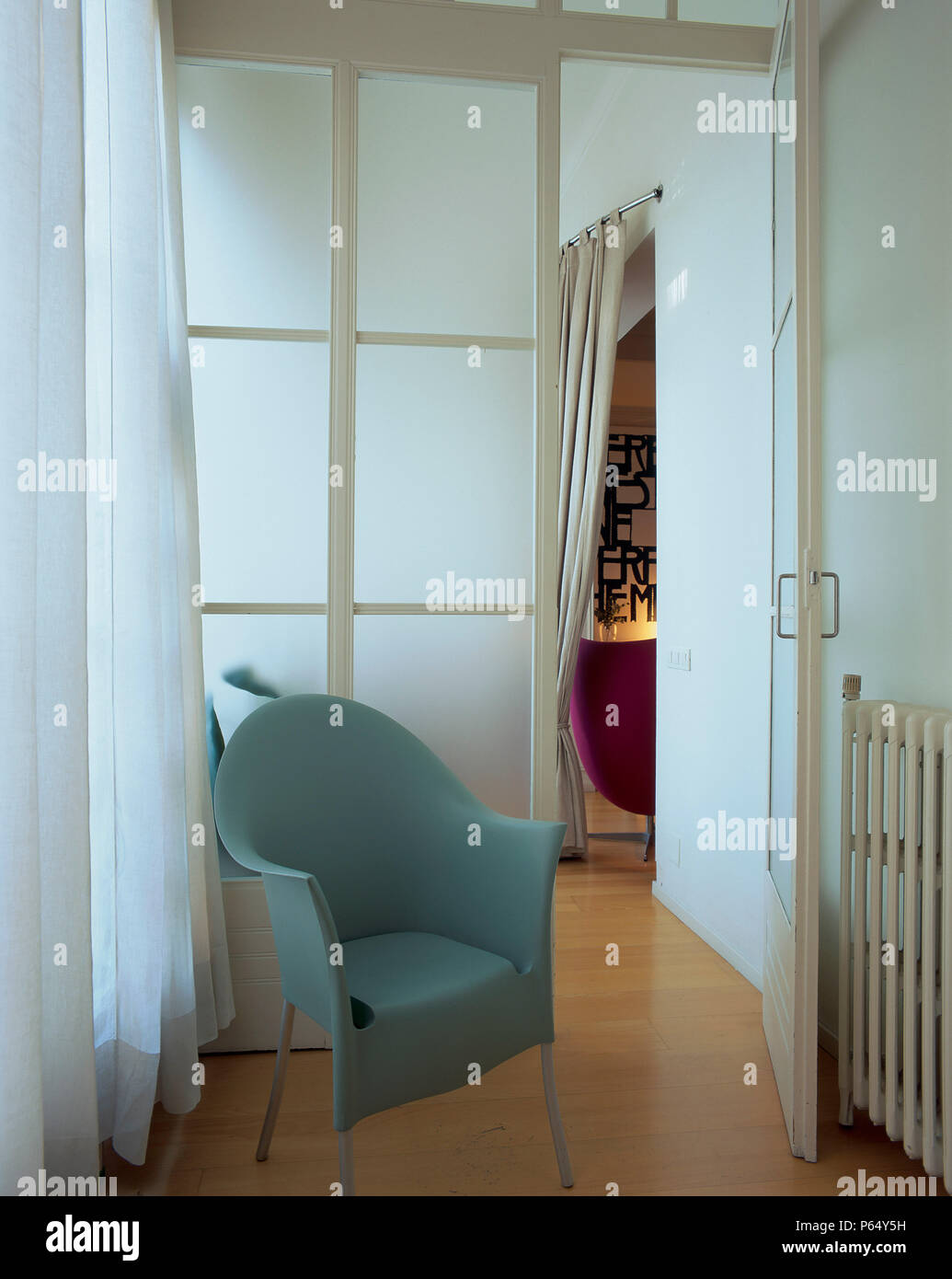 View of a chair in a corridor Stock Photo - Alamy