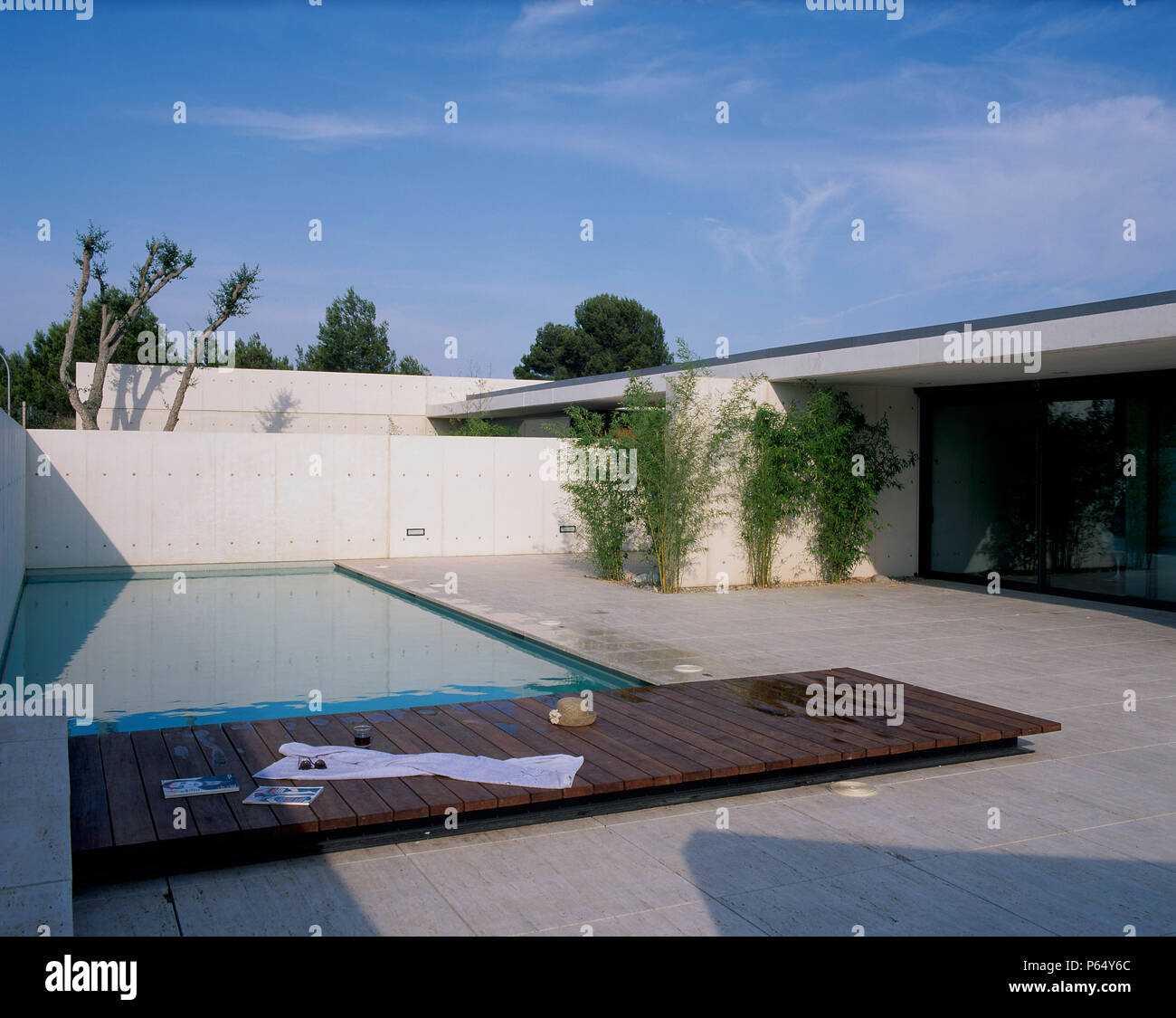 View of a clean swimming pool outside a building Stock Photo - Alamy