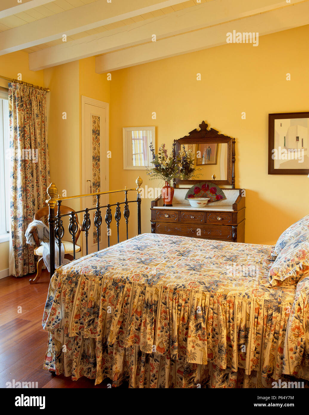 View of a comfortable bed in a bedroom Stock Photo - Alamy