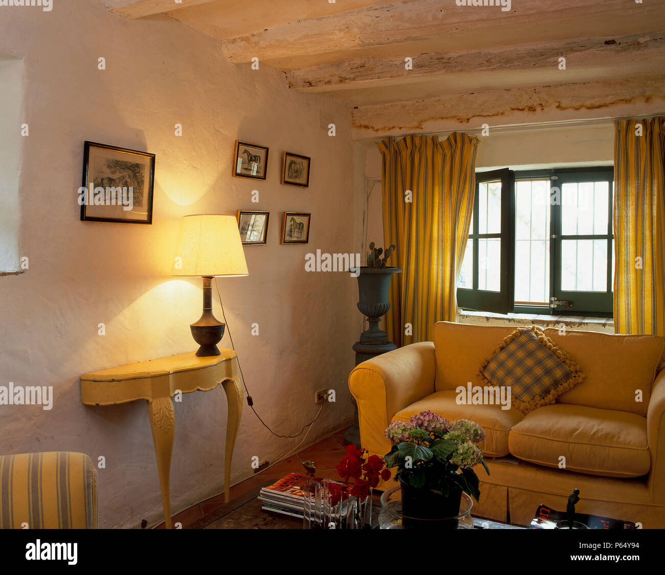 View of a couch in a cozy living room Stock Photo - Alamy
