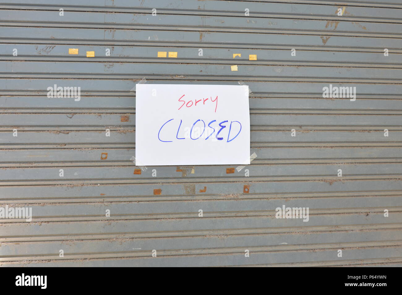 paper sign on iron louver door Stock Photo - Alamy