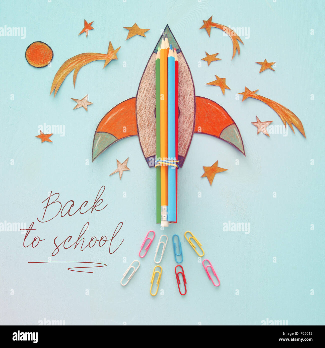 Back to school concept. rocket with pencils, space elements shapes cut ...