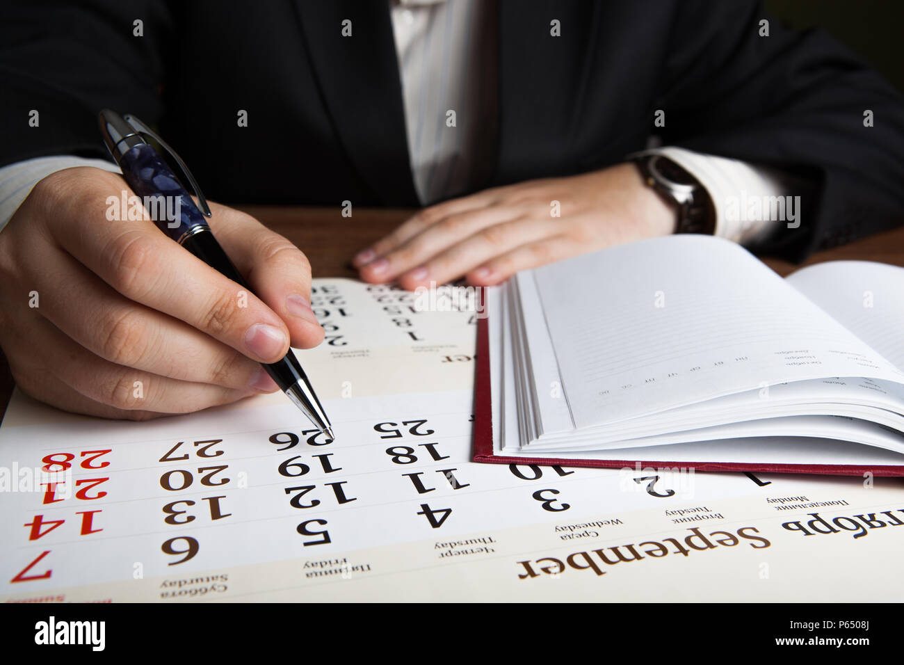 man calculates future plans with calendar close up Stock Photo - Alamy