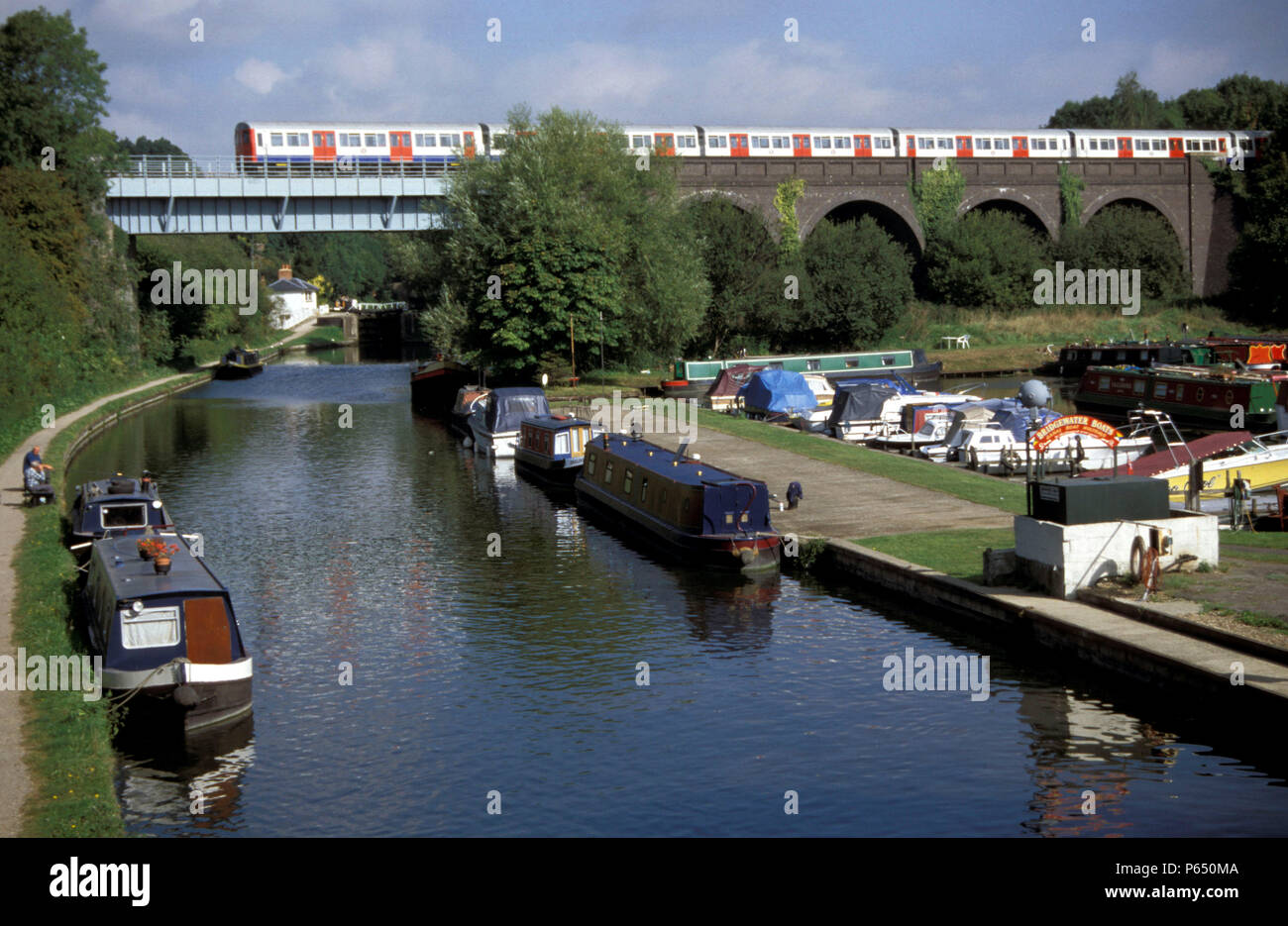 A Bakerloo line train crosses the Grand Union canal near to Watford ...