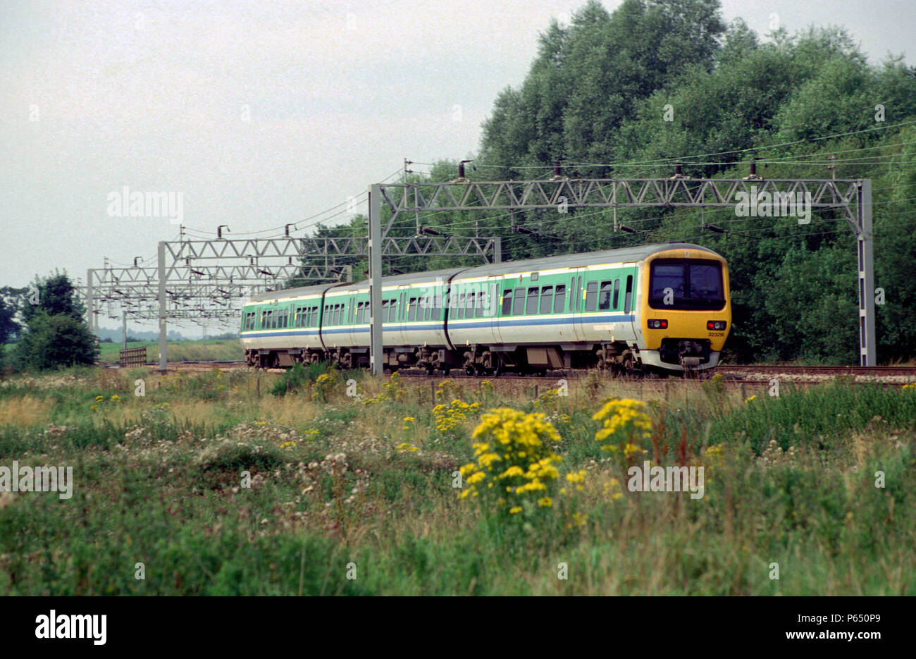 A Central Trains class 323 unit travels through the English countryside ...