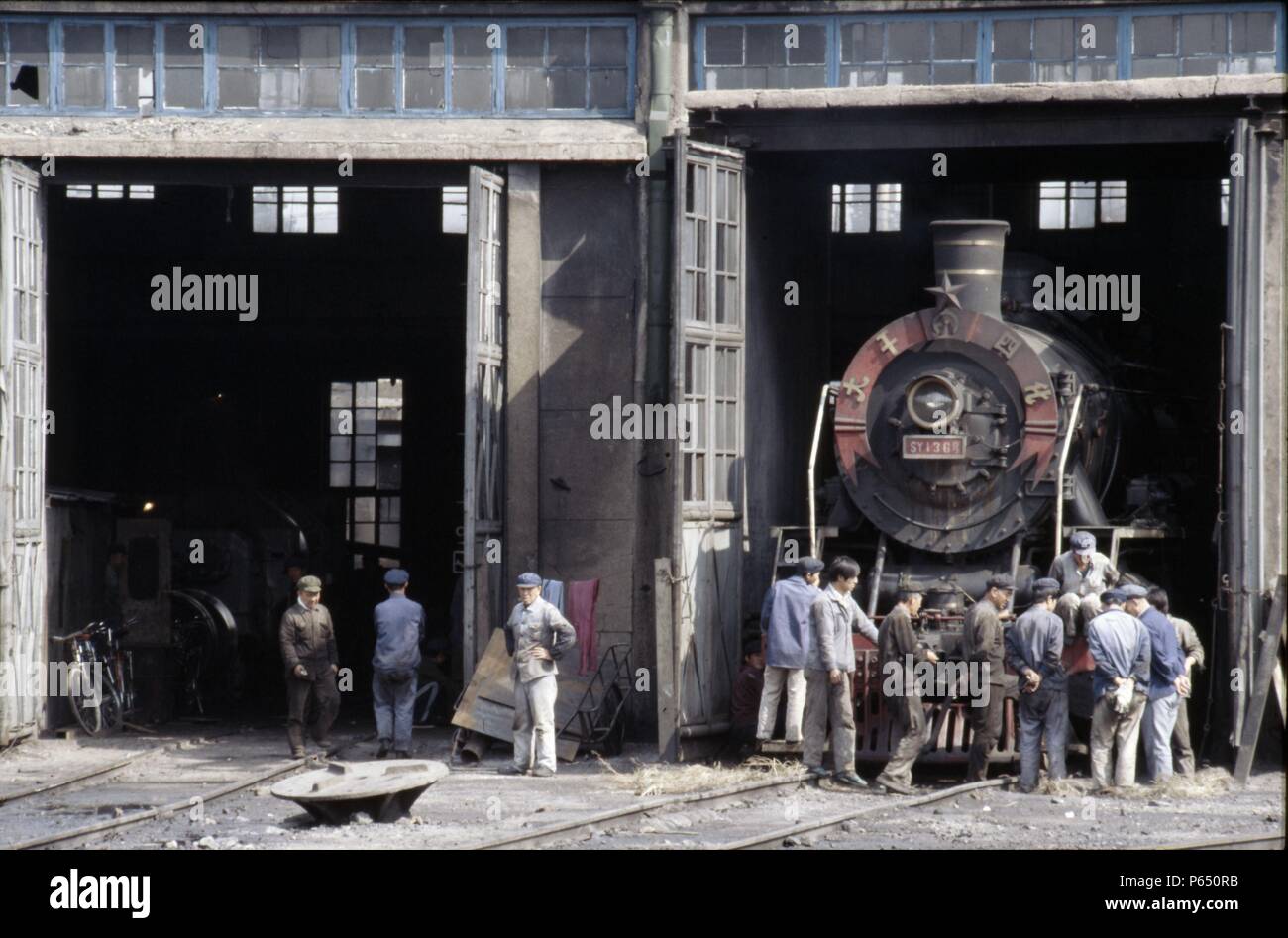 A Chinese Industrial SY Class Mikado 2-8-2 waits to receive a major ...