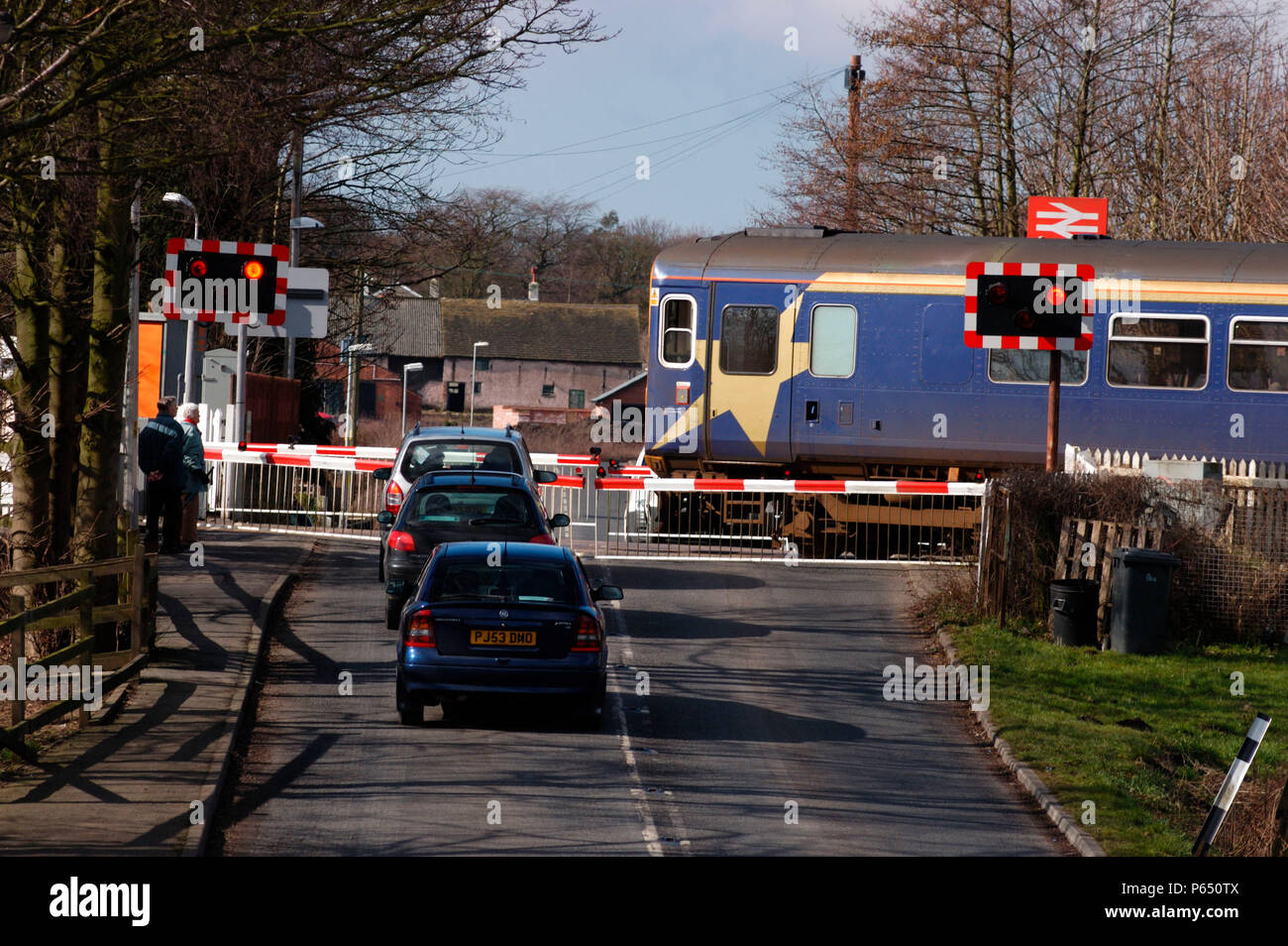 A Class 153 Sprinter DMU trainset on approach to Rufford station with a ...