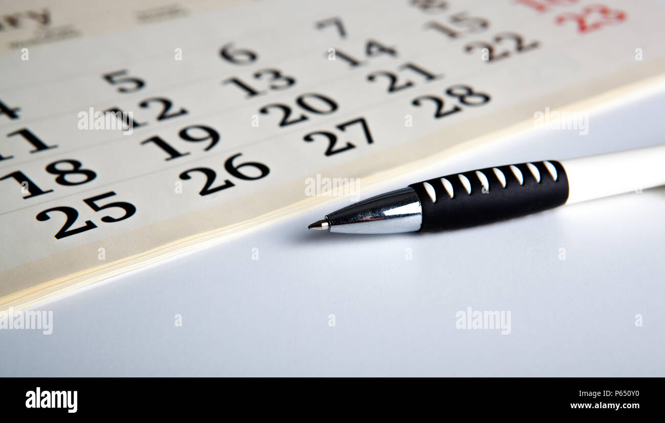 calendar days with numbers and pen close up Stock Photo - Alamy